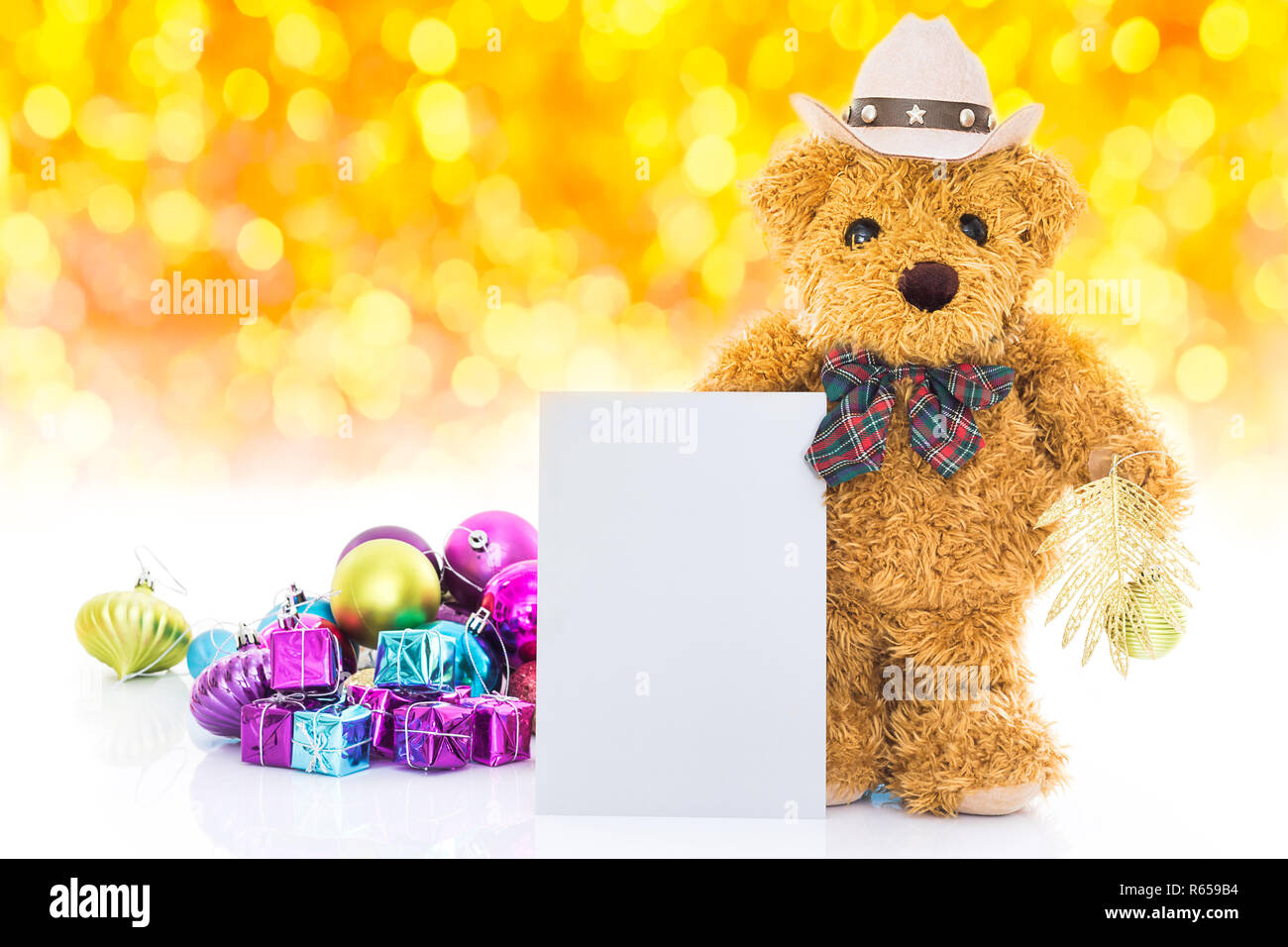 Teddy bear with gifts and greeting card Stock Photo - Alamy