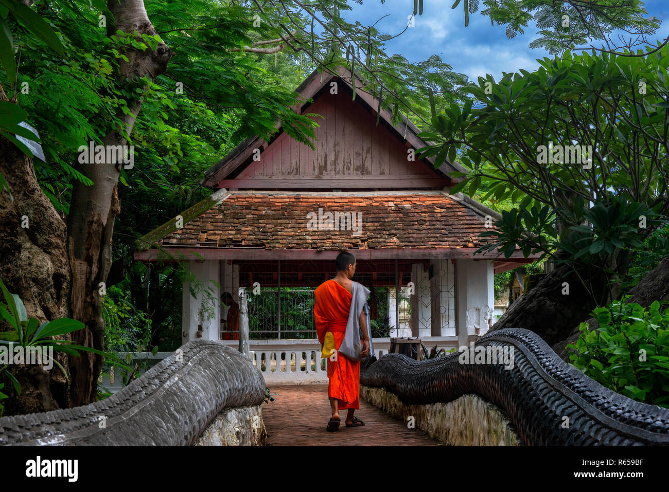 Monk in Wat Phousi temple on the Mount Phou Si, Luang Prabang, Laos ...
