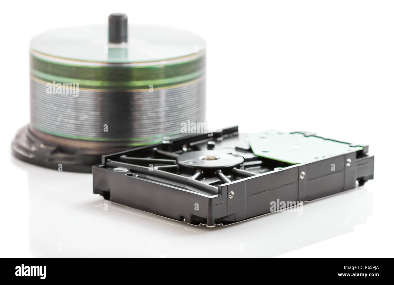 Hard disk drive and compact discs Stock Photo - Alamy