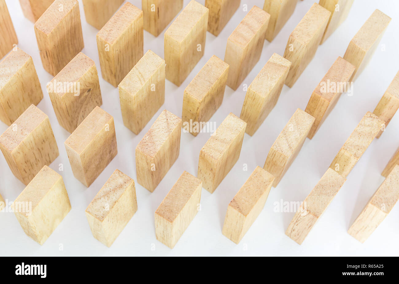 Wooden Domino in row Stock Photo - Alamy