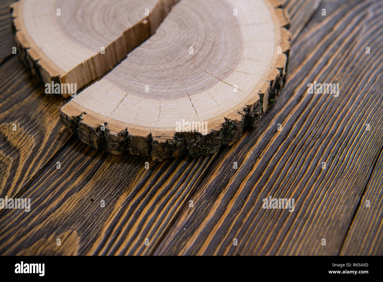 Tree stump round cut with annual rings on wooden background from top ...