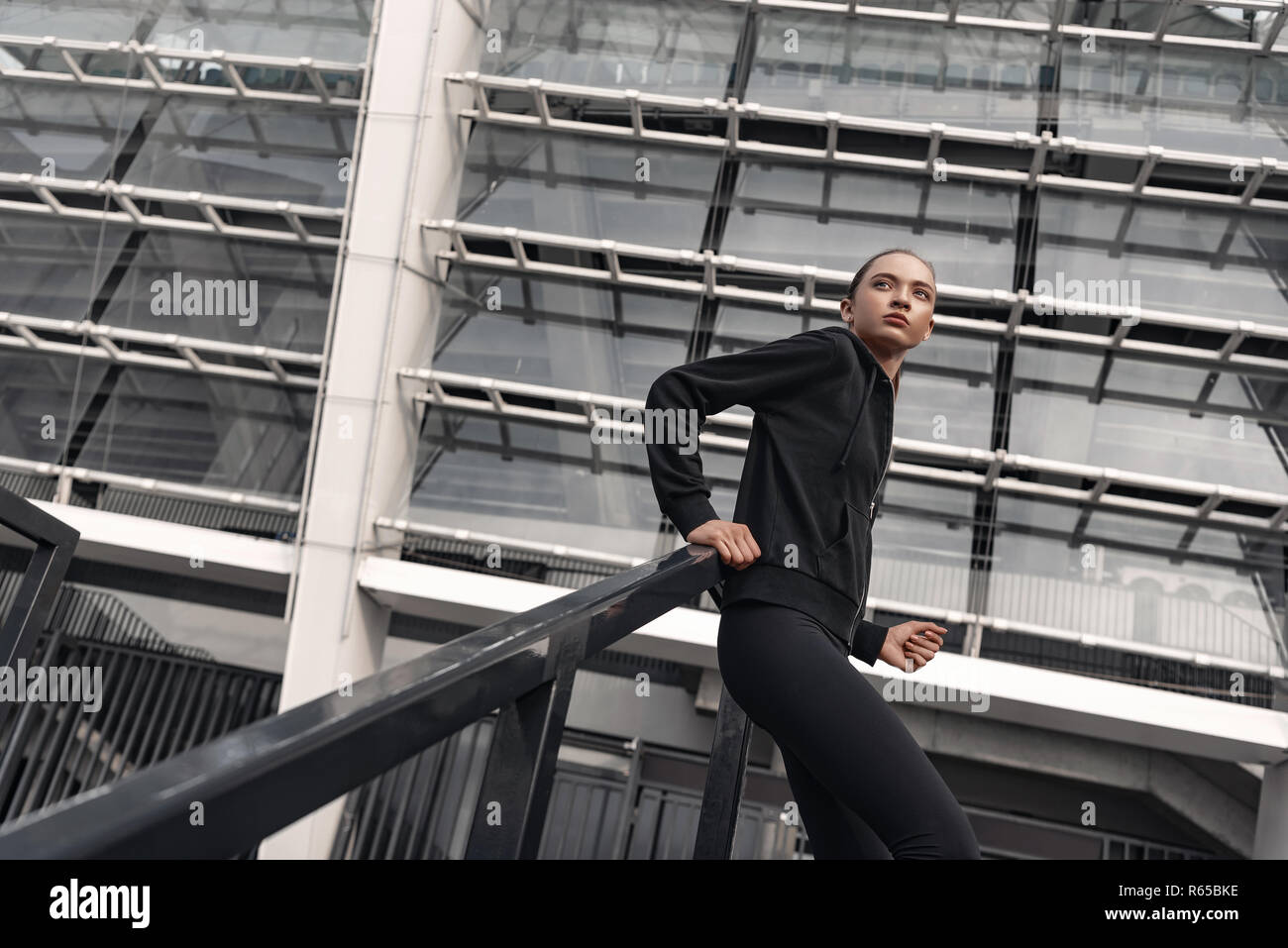 Standing at bottom of stairs hi-res stock photography and images - Alamy