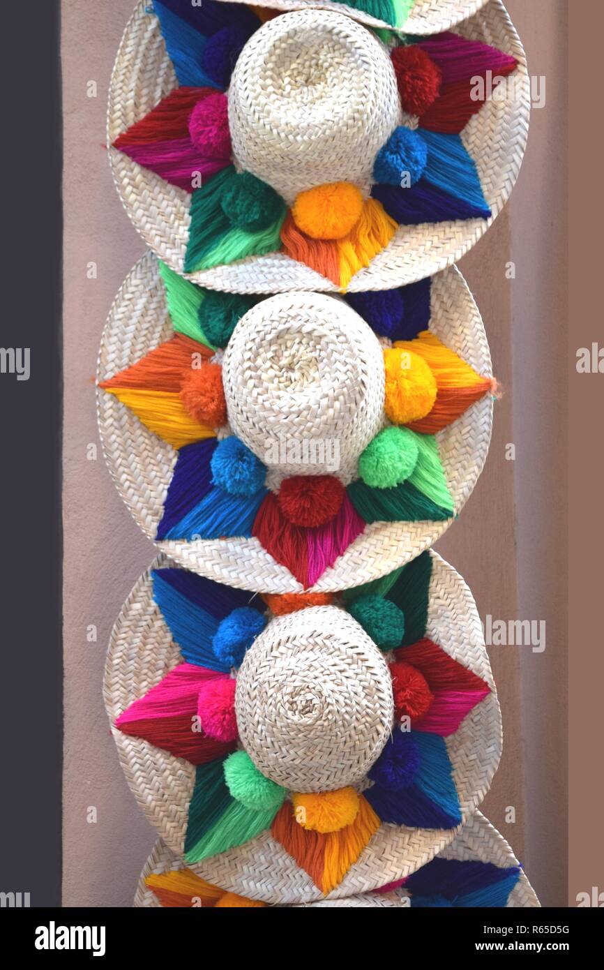 Coloured straw hats hi-res stock photography and images - Alamy