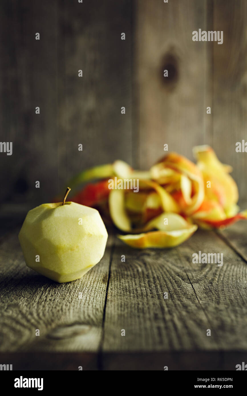 Apple with peeled skin Stock Photo - Alamy