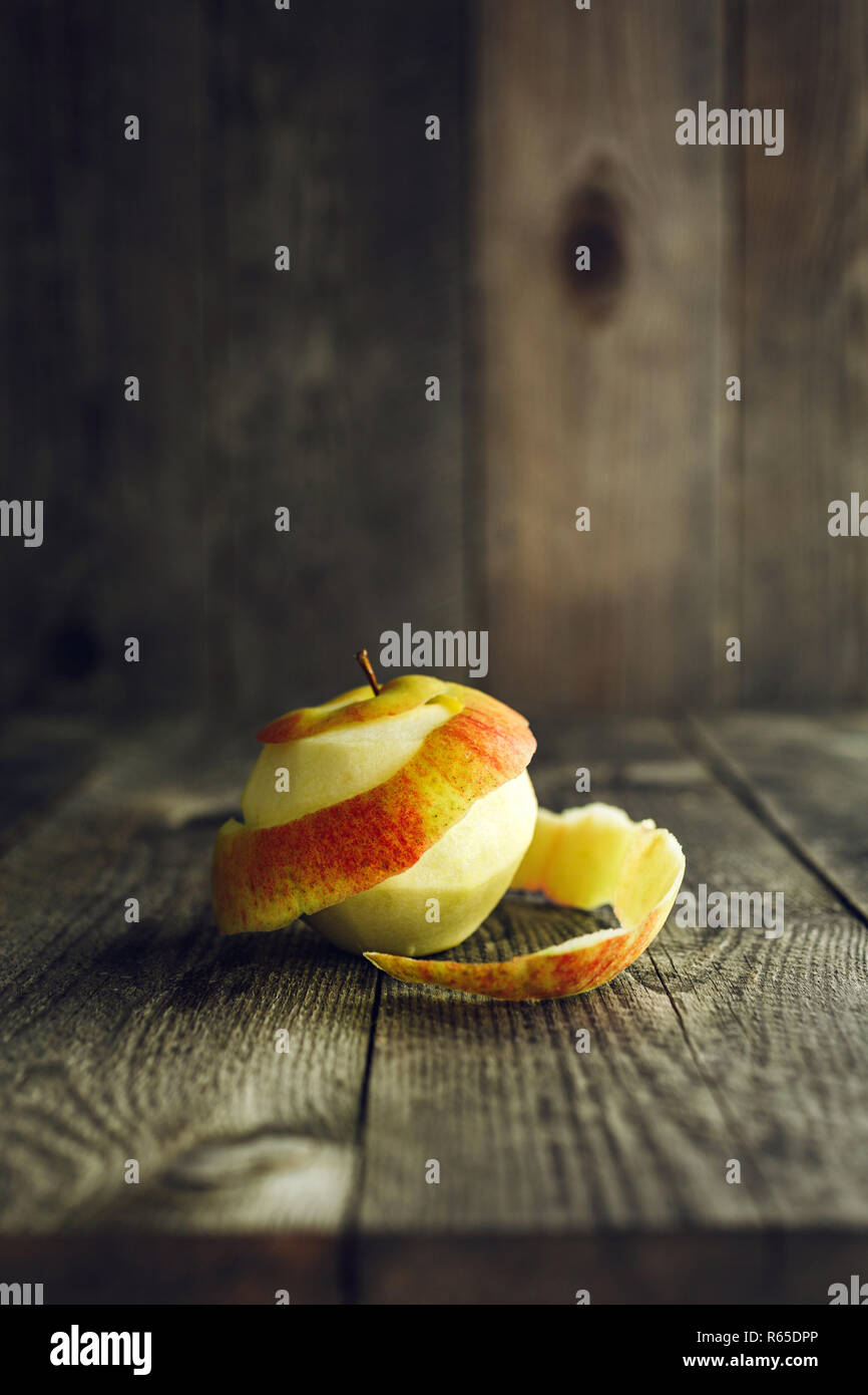 Apple with peeled skin Stock Photo - Alamy