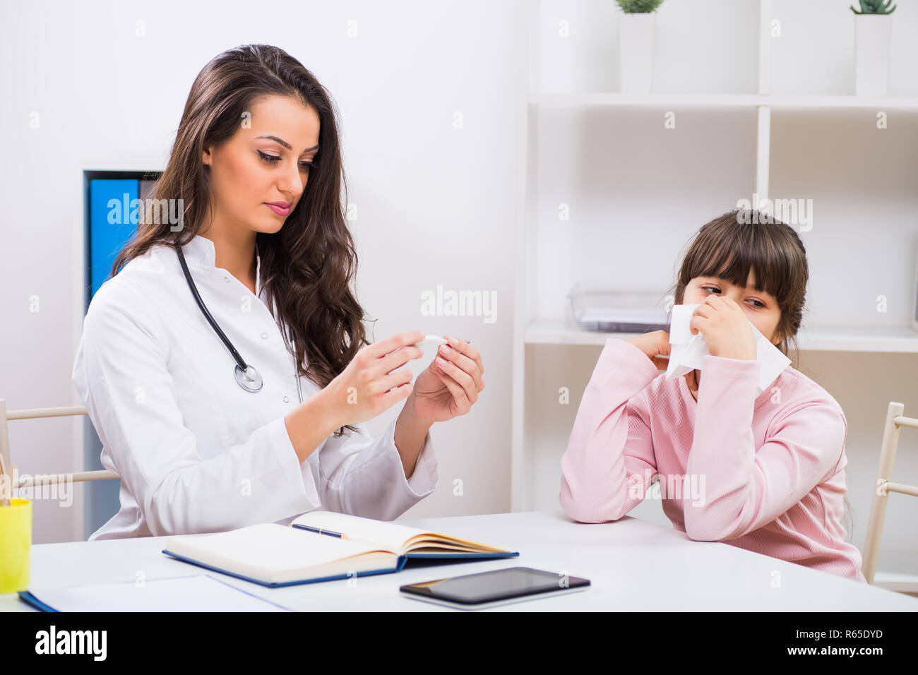 Doctor checking temperature hi-res stock photography and images - Alamy