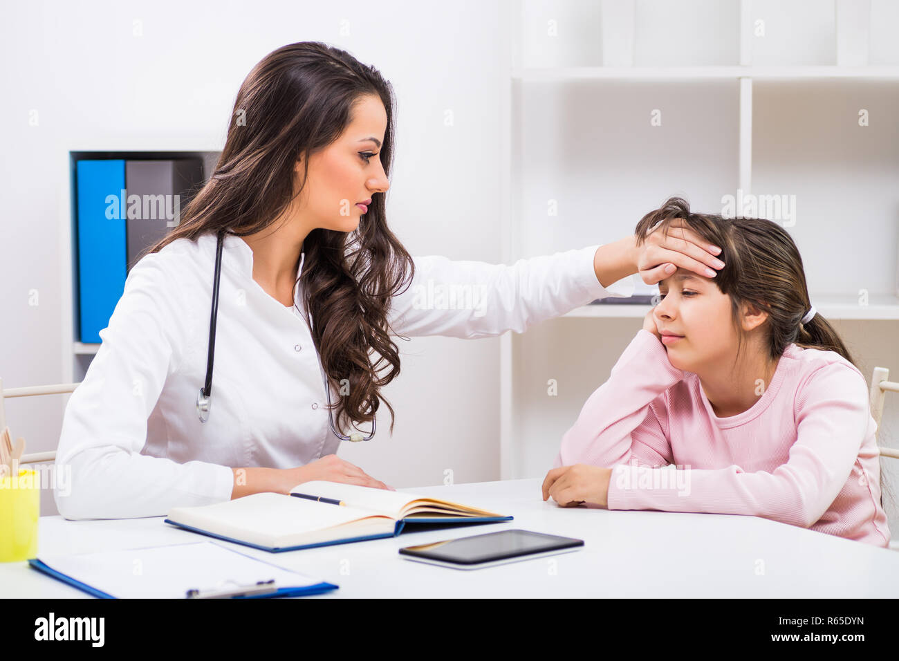 Doctor checking temperature hi-res stock photography and images - Alamy