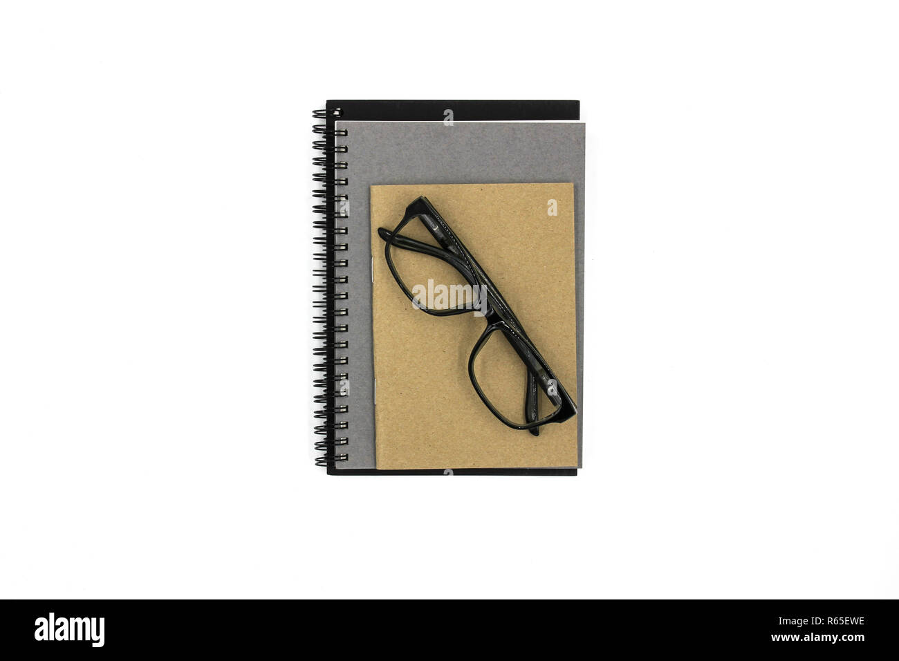 Notebook and glasses isolated on white background Stock Photo - Alamy