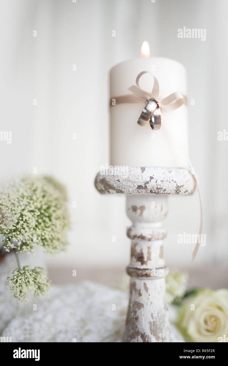 wedding rings with candle Stock Photo - Alamy