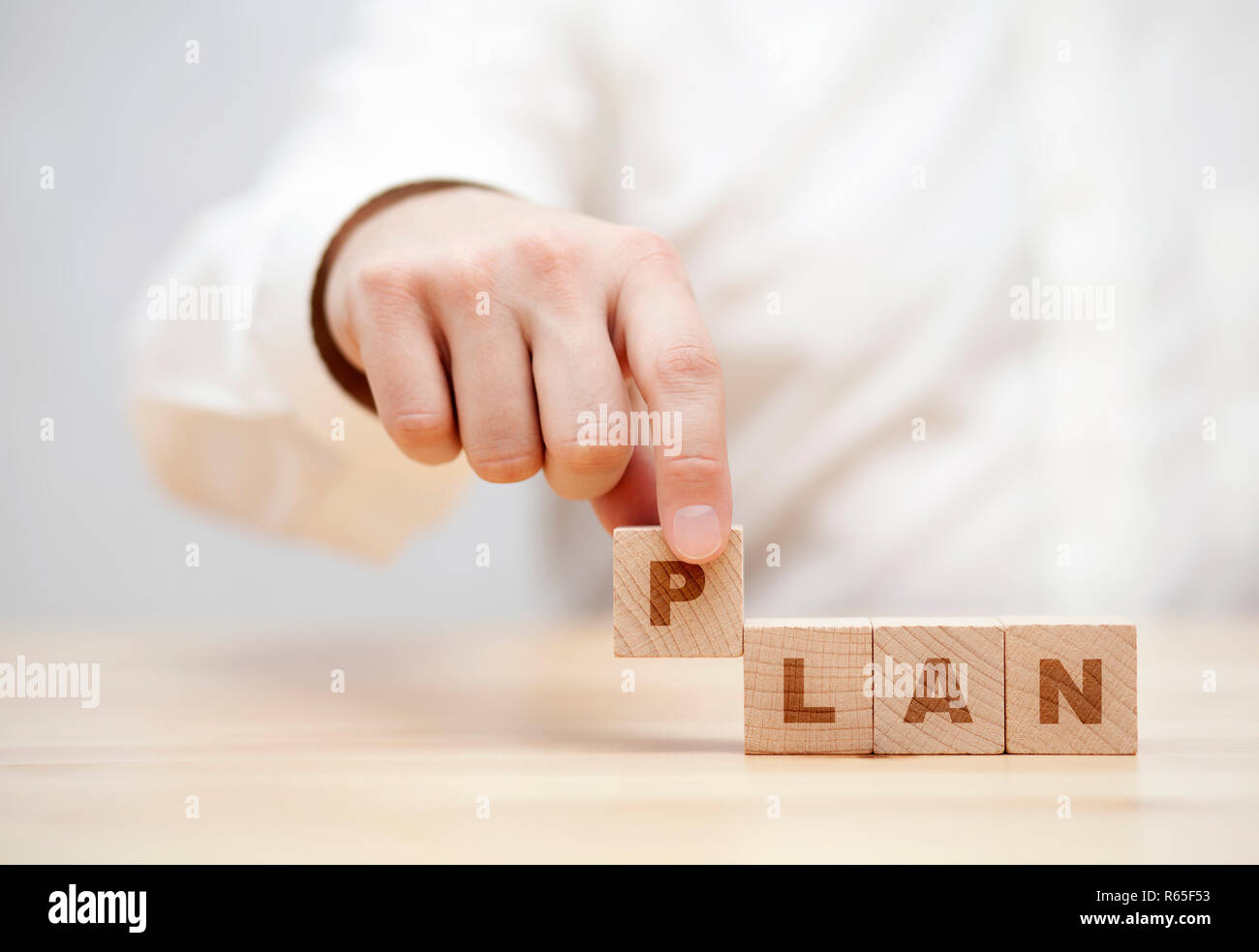 Hand and word Plan made with wooden building blocks Stock Photo - Alamy