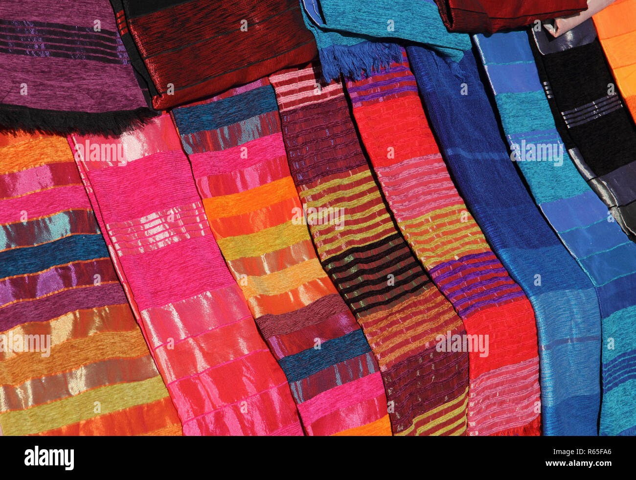 Morocco. Typical colourful hand crafted silk cloth covers on display in ...
