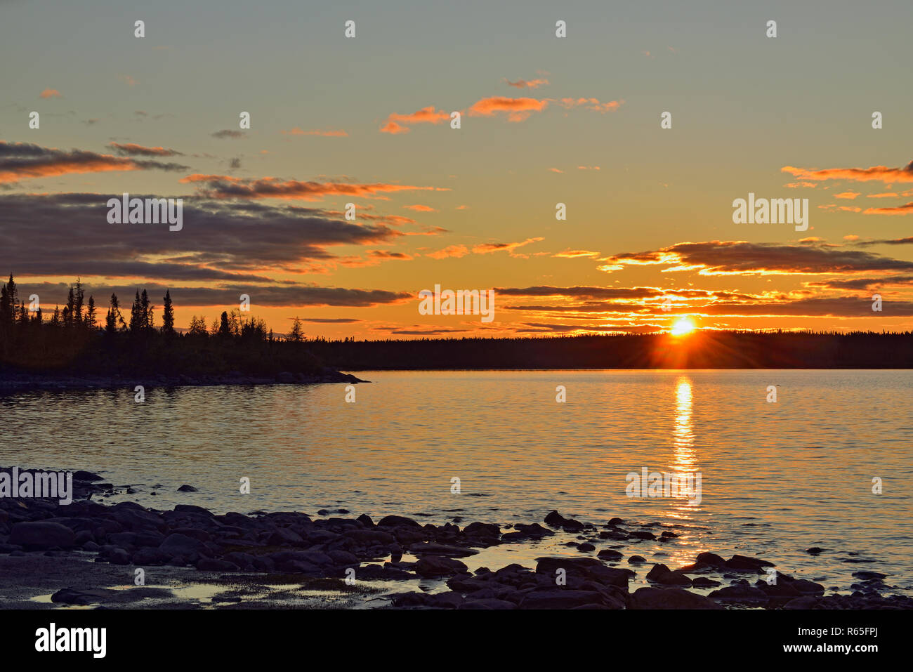 Sunset skies over Ennadai Lake, Arctic haven lodge at Ennadai Lake ...