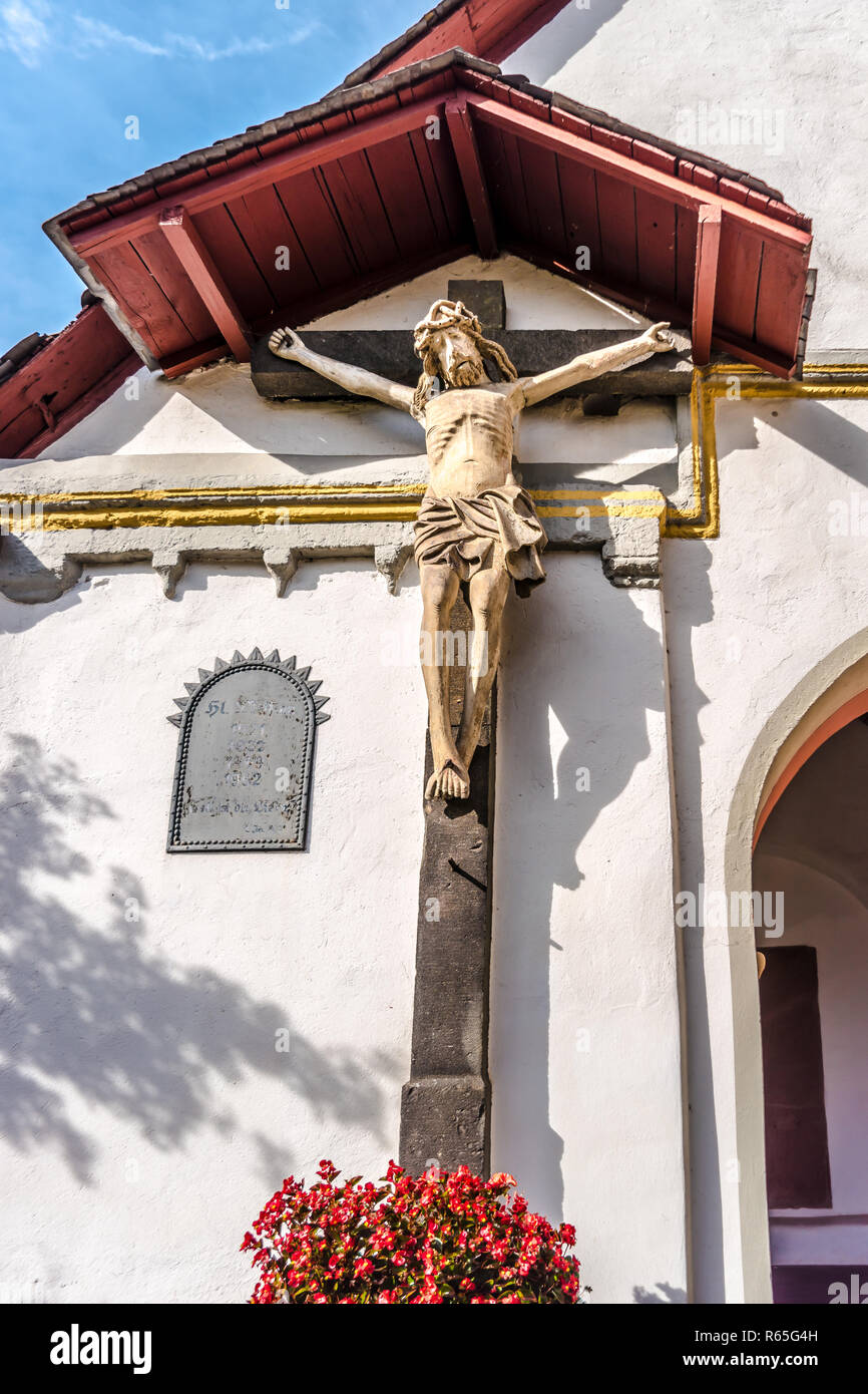 Jesus Christ Monument on a stone cross on a church fassade Stock Photo ...