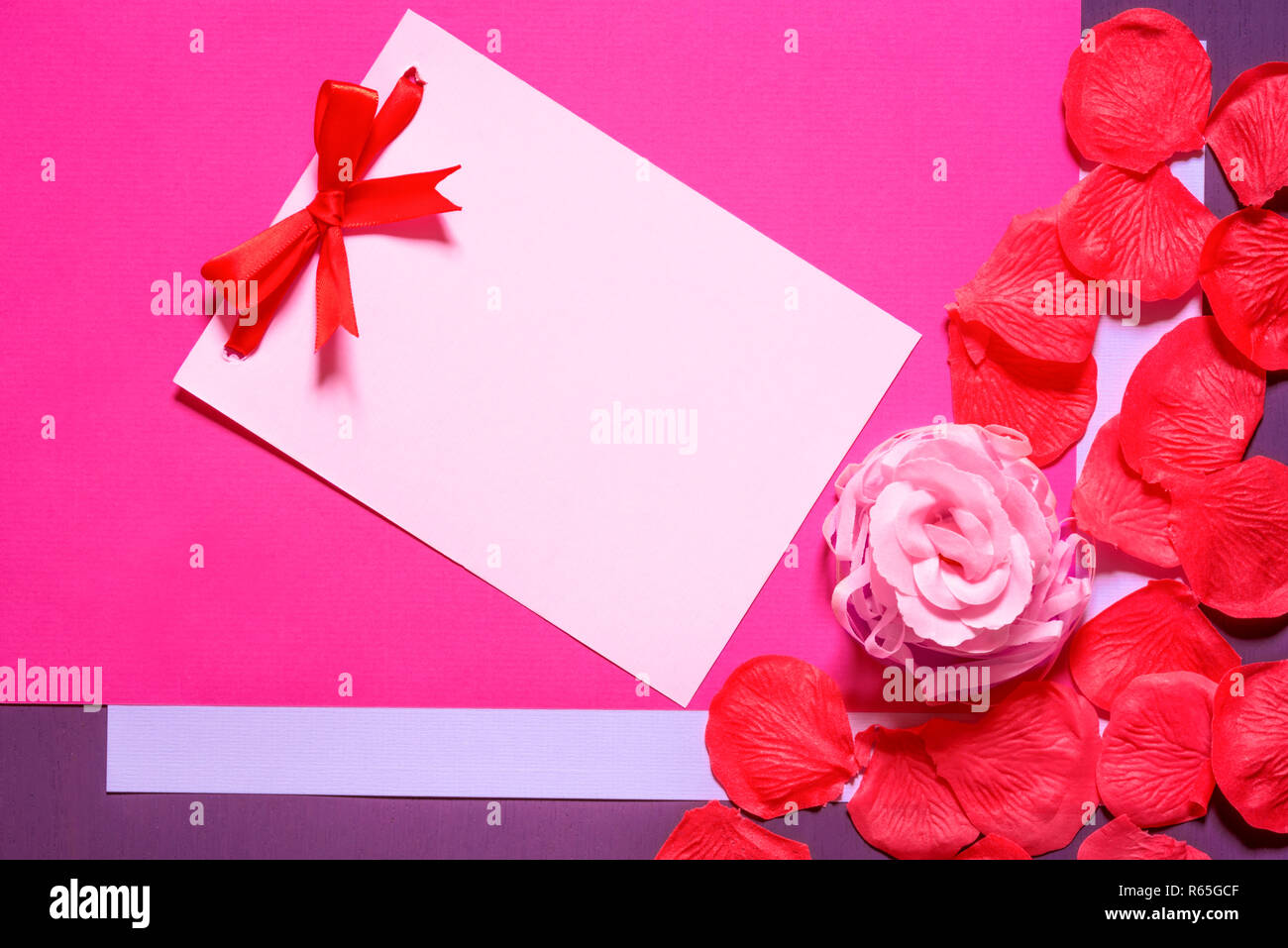 Rose petals and a cute message card Stock Photo - Alamy