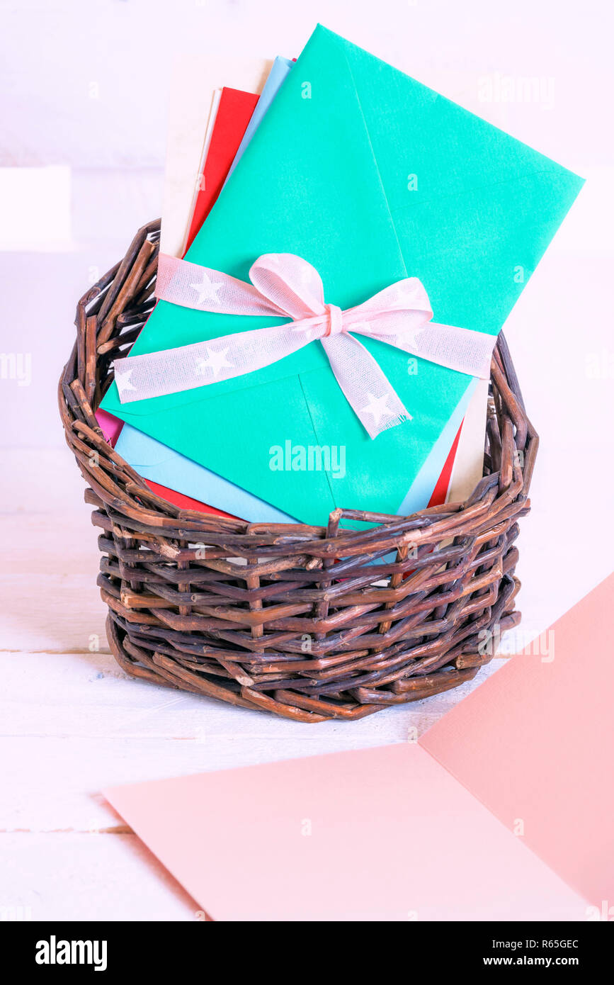 Basket full of letters and a blank message card Stock Photo - Alamy