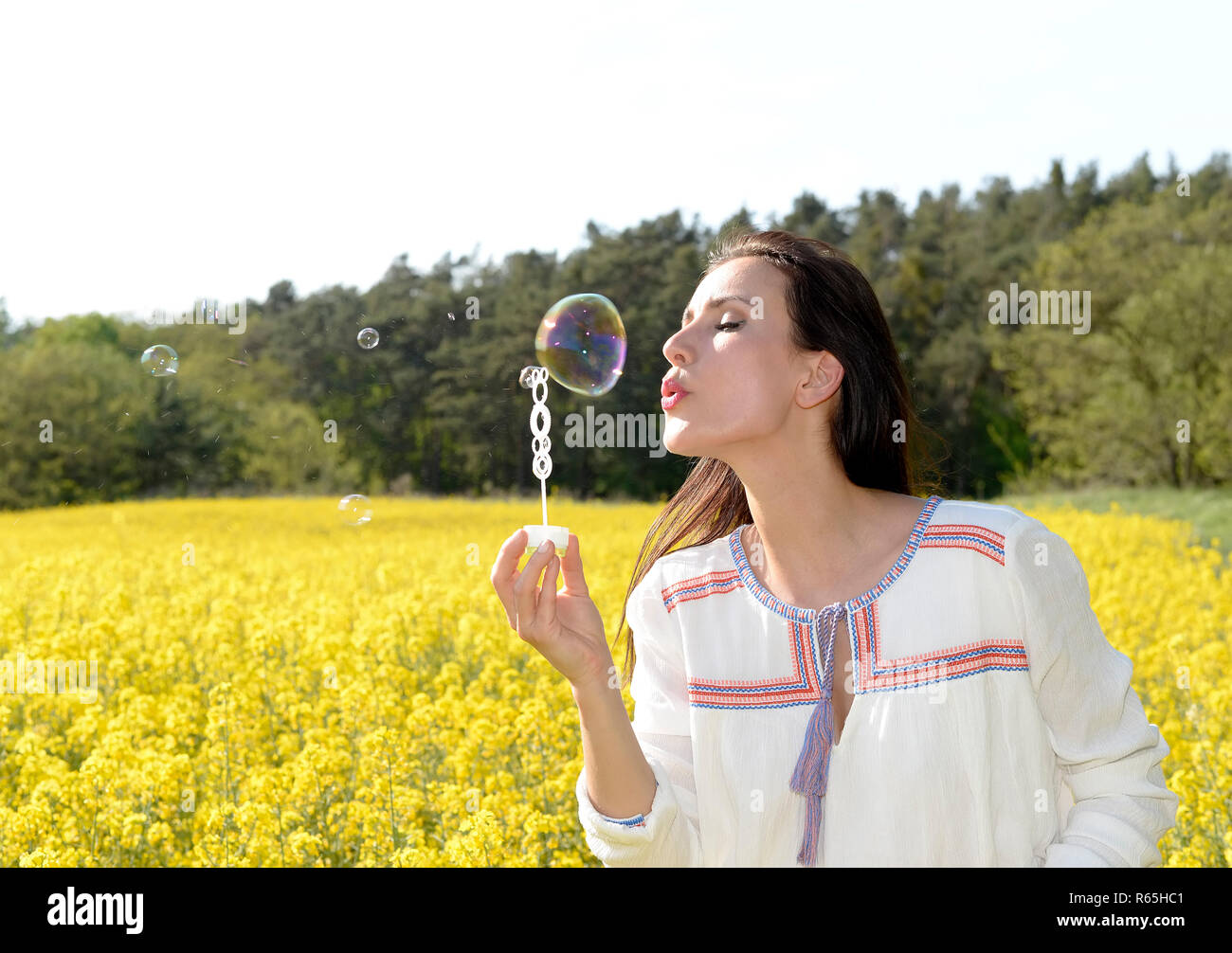 woman blowing bubbles Stock Photo - Alamy
