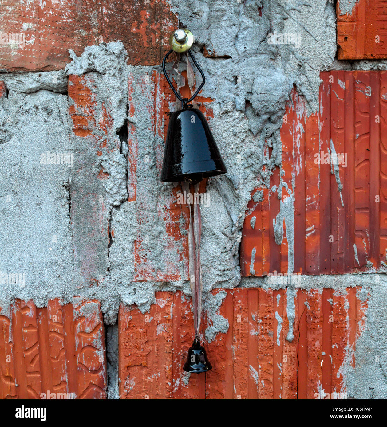 Old bell used on cattle, hanging on wall Stock Photo - Alamy