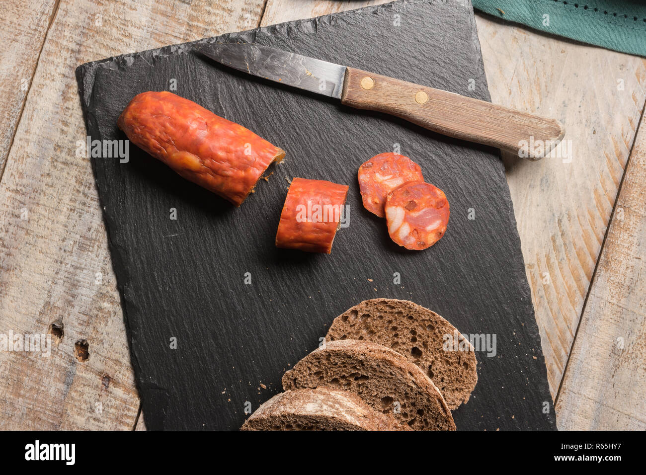 Malt loaf bread and chorizo slices Stock Photo - Alamy