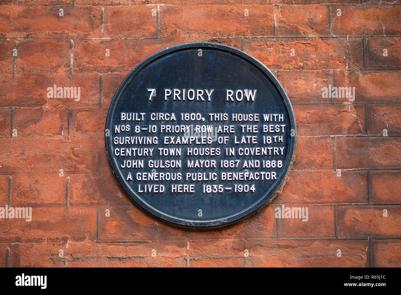 A plaque at 7 Priory Row in the historic city centre of Coventry ...