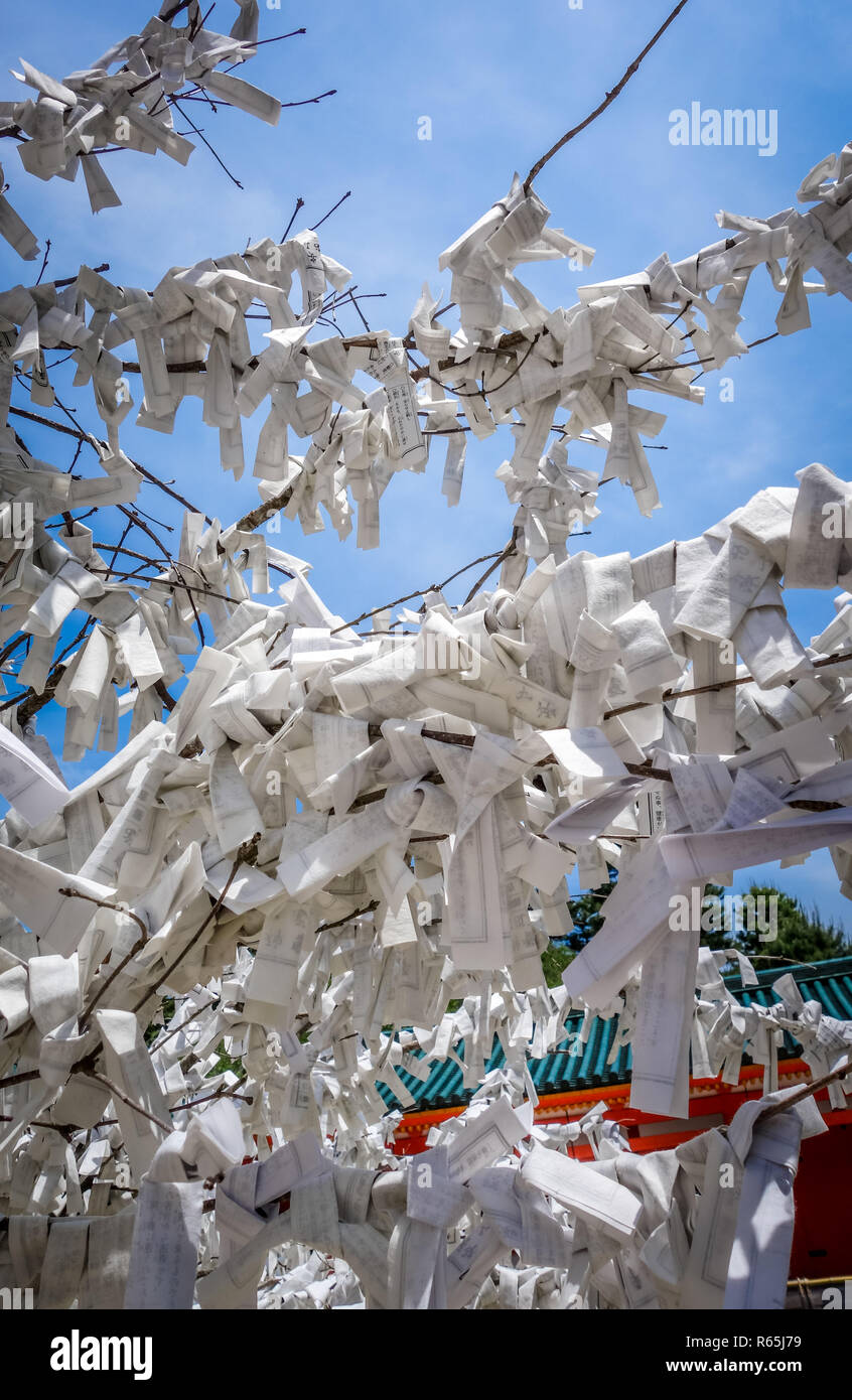 Omikuji tree at Heian Jingu Shrine temple, Kyoto, Japan Stock Photo - Alamy