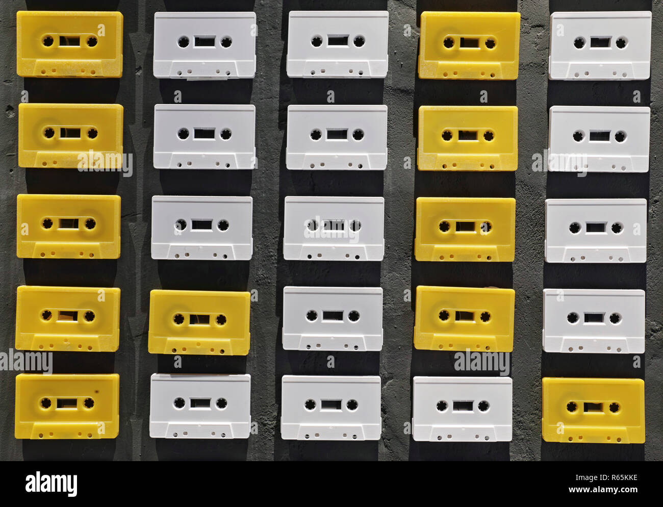 Wall decorated with white and yellow several music tapes at The Student ...