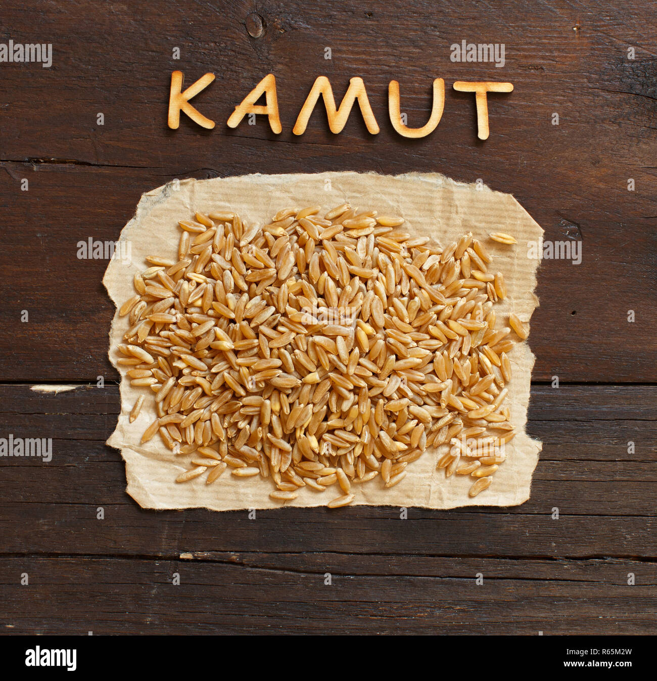 Pile of Kamut grain with wooden letters Stock Photo - Alamy