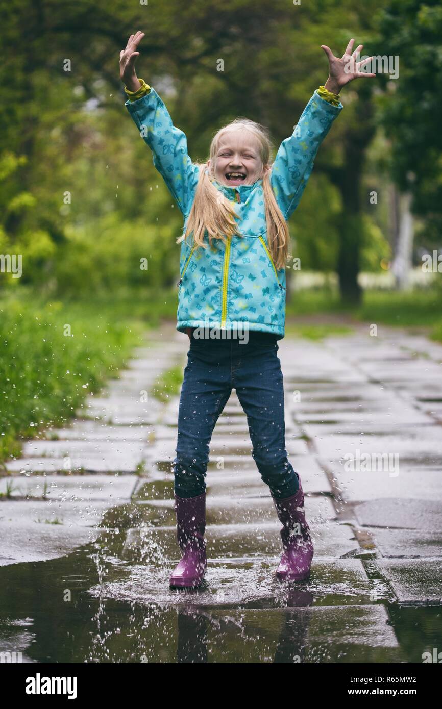 Kids jump puddle hi-res stock photography and images - Alamy