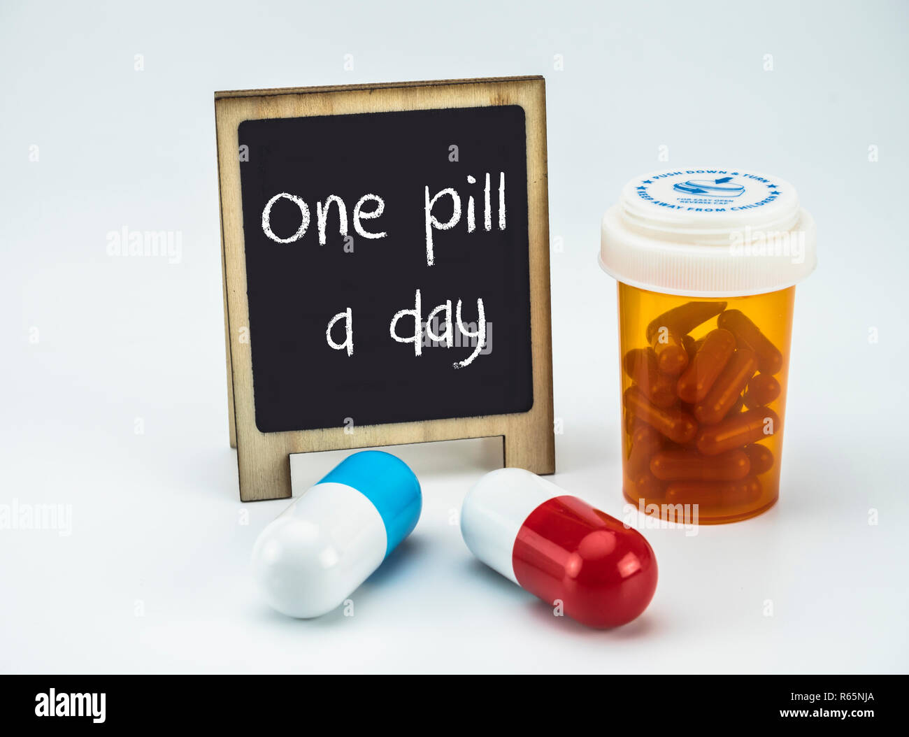 One pill a day on a whiteboard next to bottles of medicines, asylee on ...