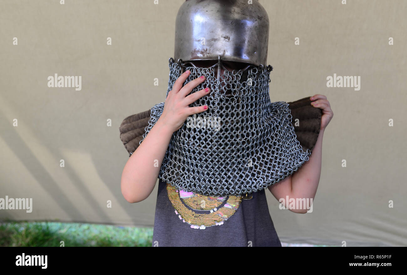 little girl wearing a medieval armour metal helmet Stock Photo - Alamy