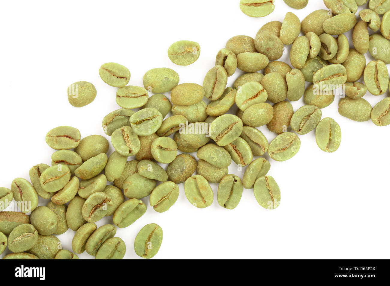 green coffee beans isolated on white background close up. Top view ...