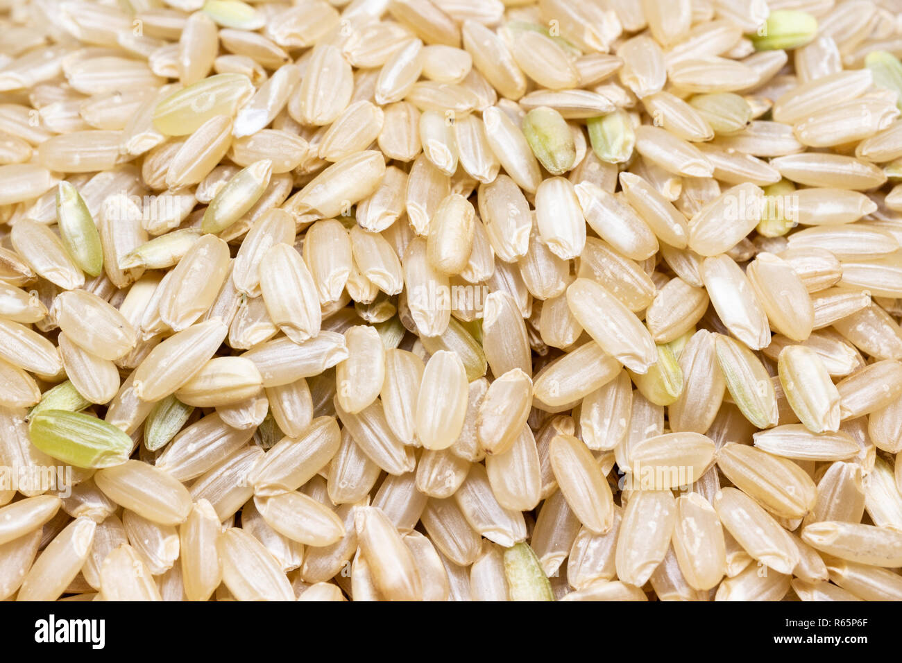 Whole grain brown rice macro Stock Photo - Alamy
