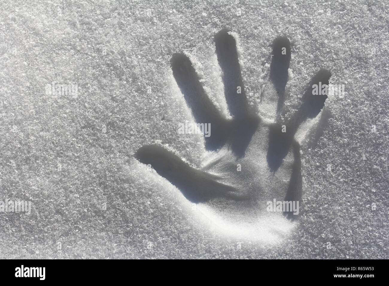 Handprint in the snow hand print imprint snow hi-res stock photography ...