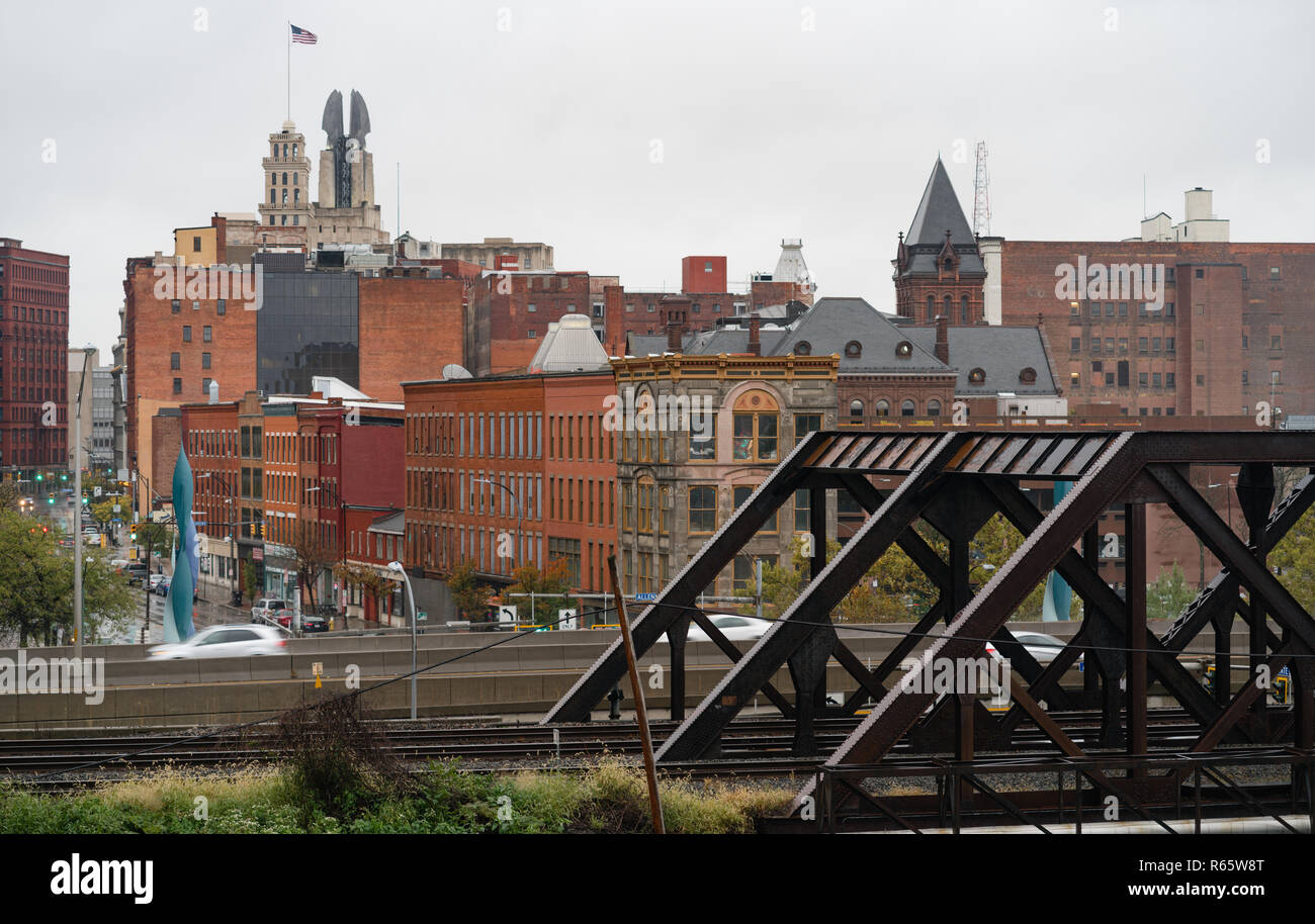 View over the train tracks and highway to the buildings of main street ...