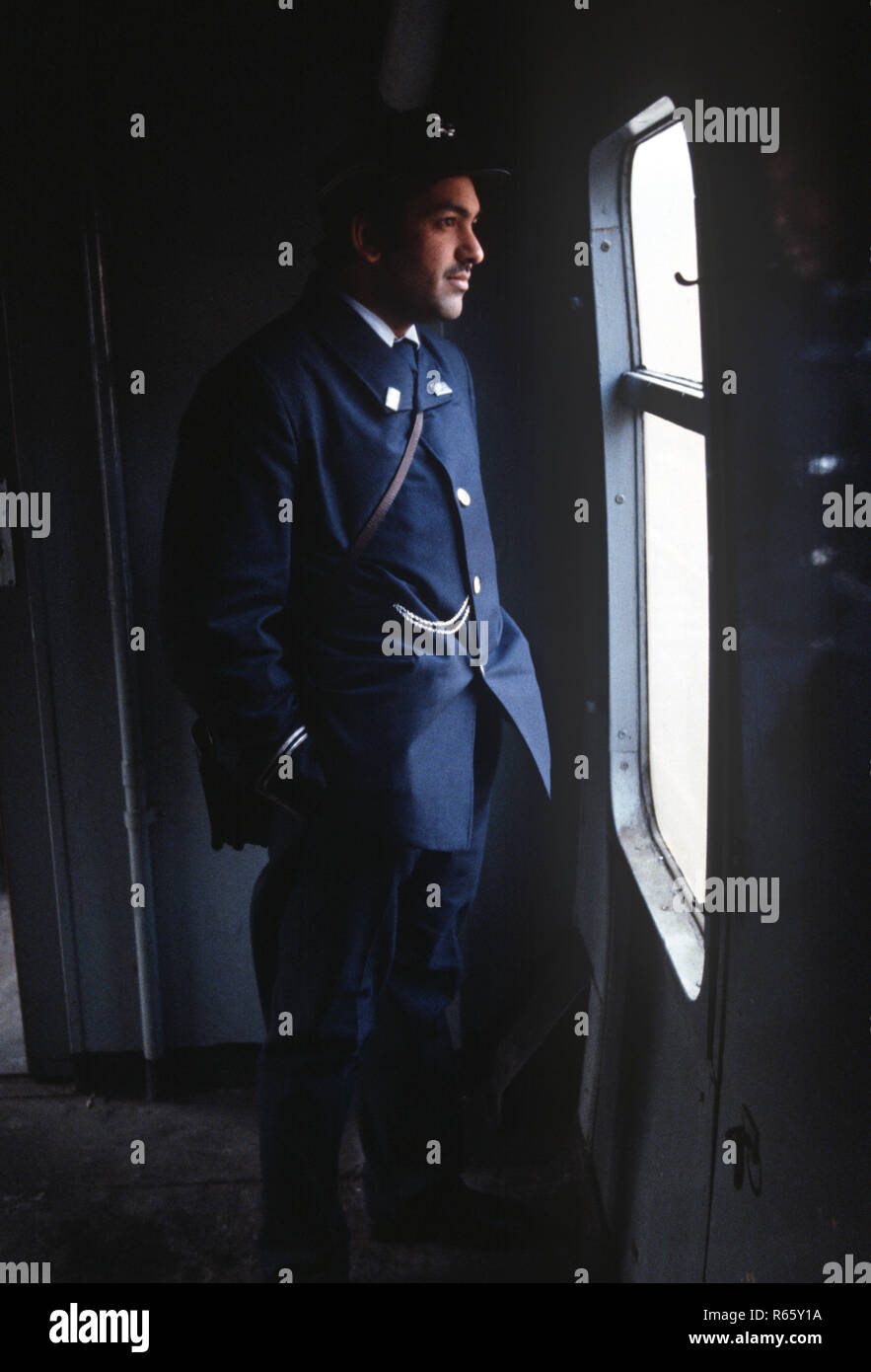 British Rail train guard on the British Rail Preston to Colne railway ...