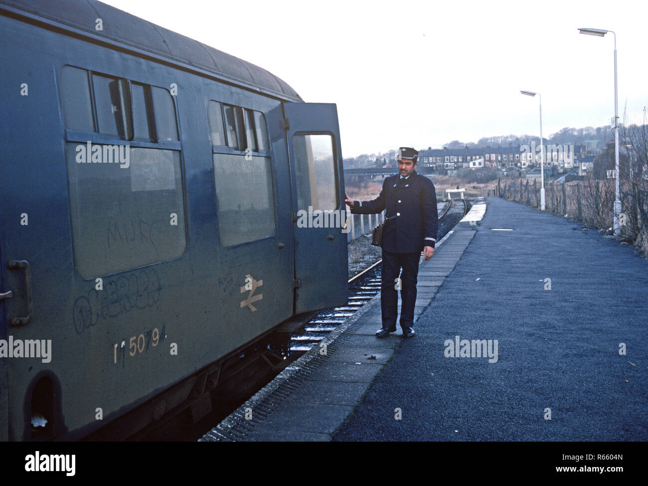 British Rail train guard on British Rail Preston to Colne railway line ...