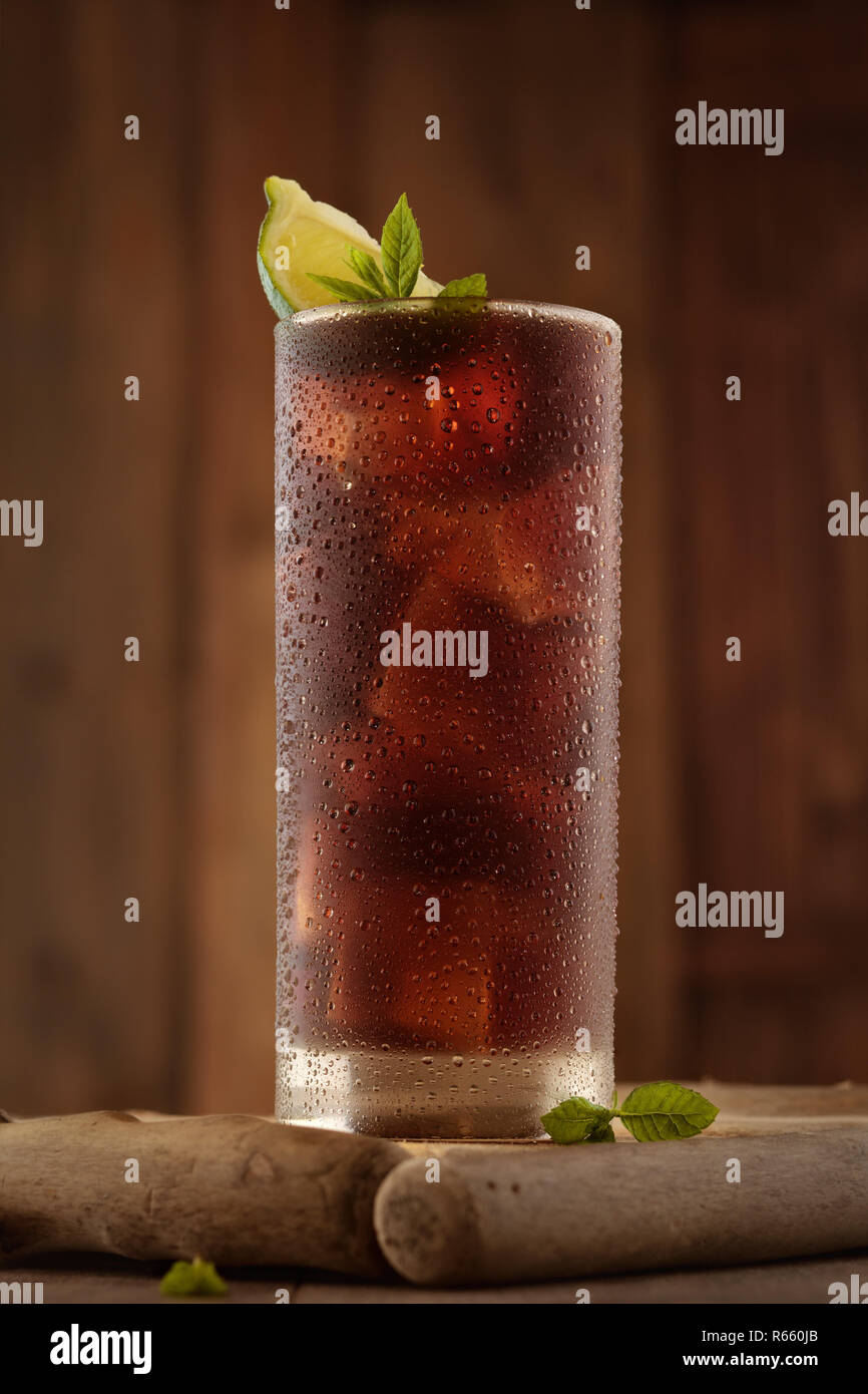 Glass of cola with ice Stock Photo - Alamy
