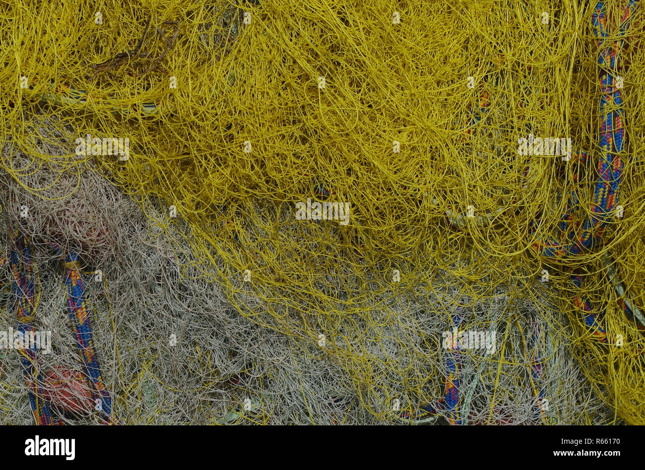 Colorful fishing net in a greek harbor Stock Photo - Alamy