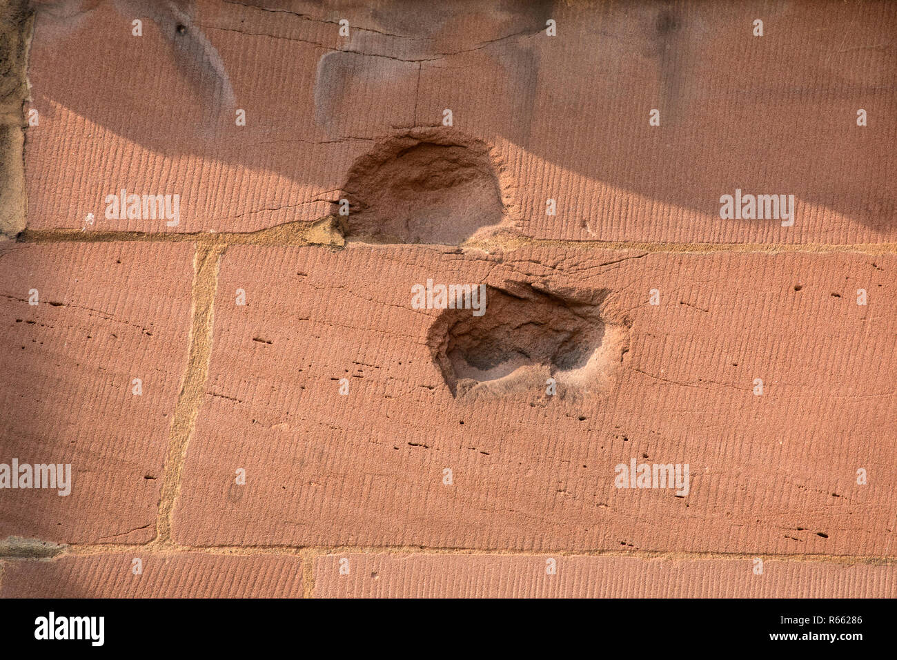Close-up of the shrapnel and bomb damage on the remains of Coventry ...