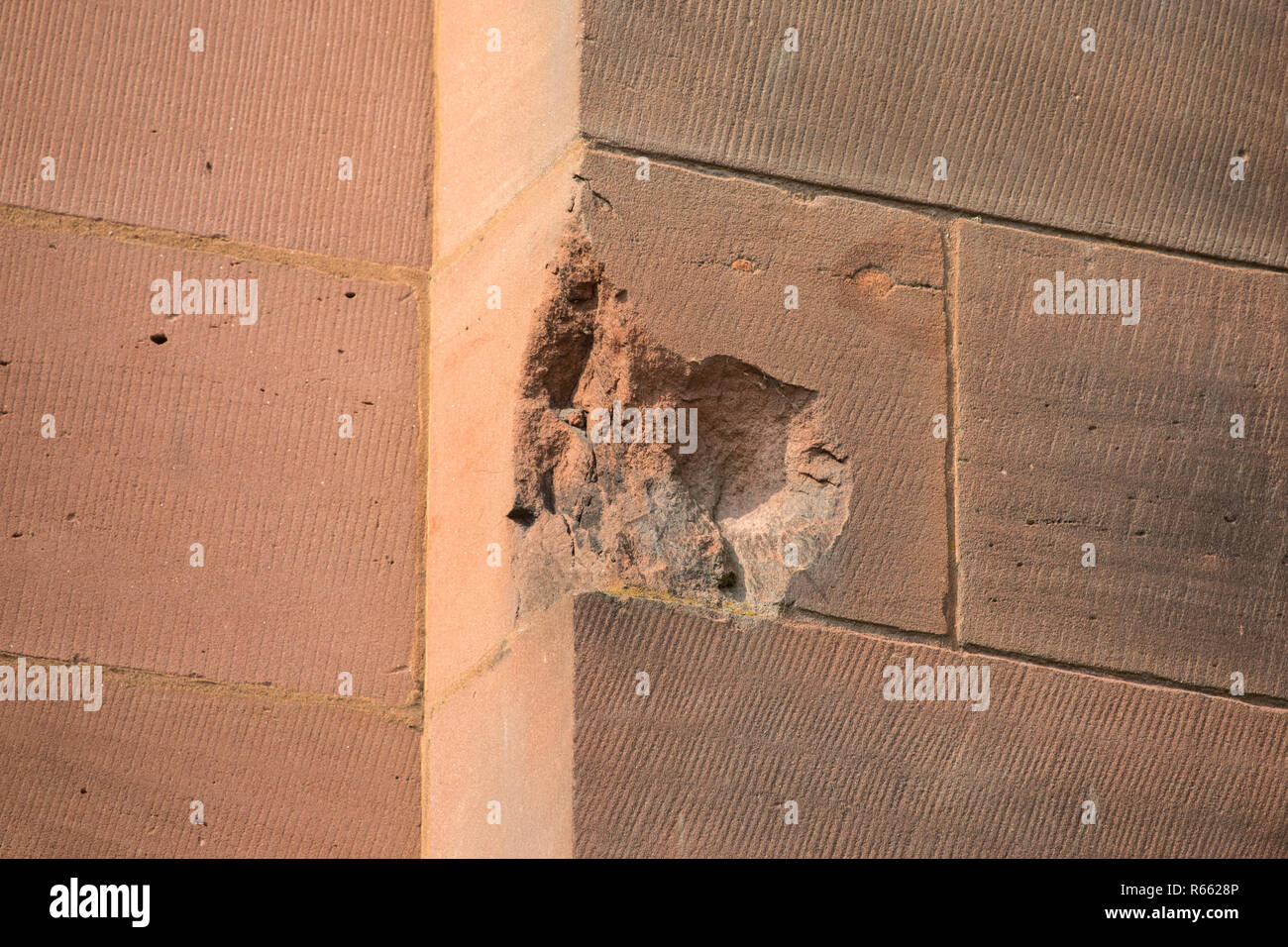 Close-up of the shrapnel and bomb damage on the remains of Coventry ...