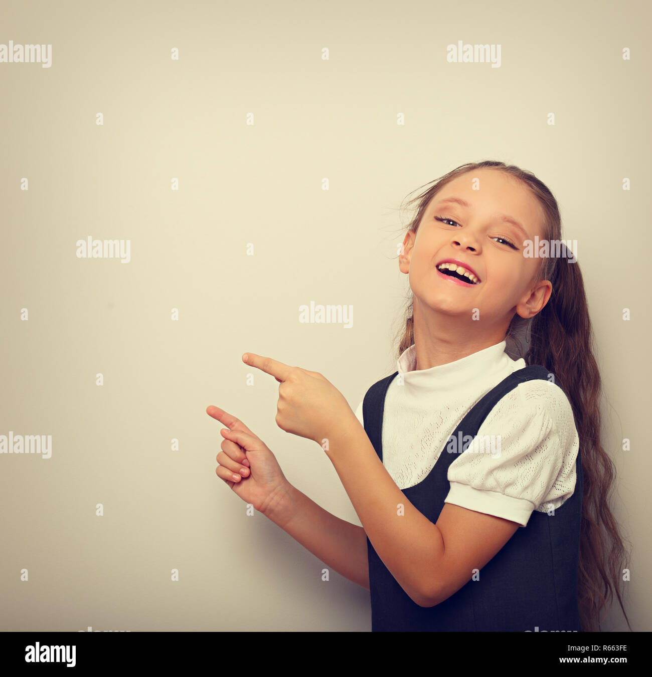 Kid pointing laughing hi-res stock photography and images - Alamy