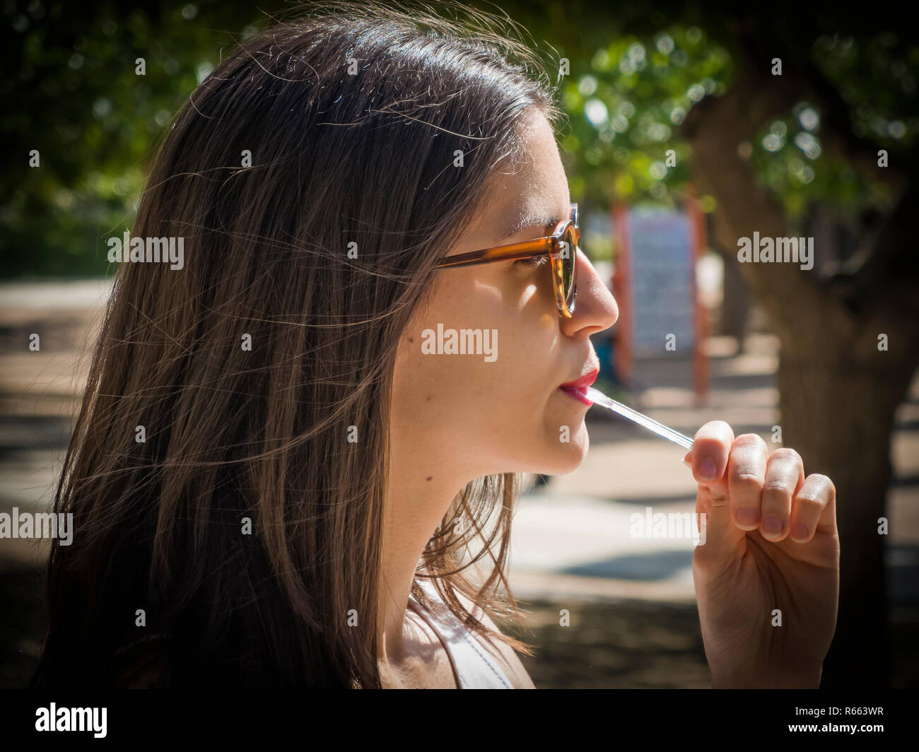Young woman eating yogurt model hi-res stock photography and images - Alamy