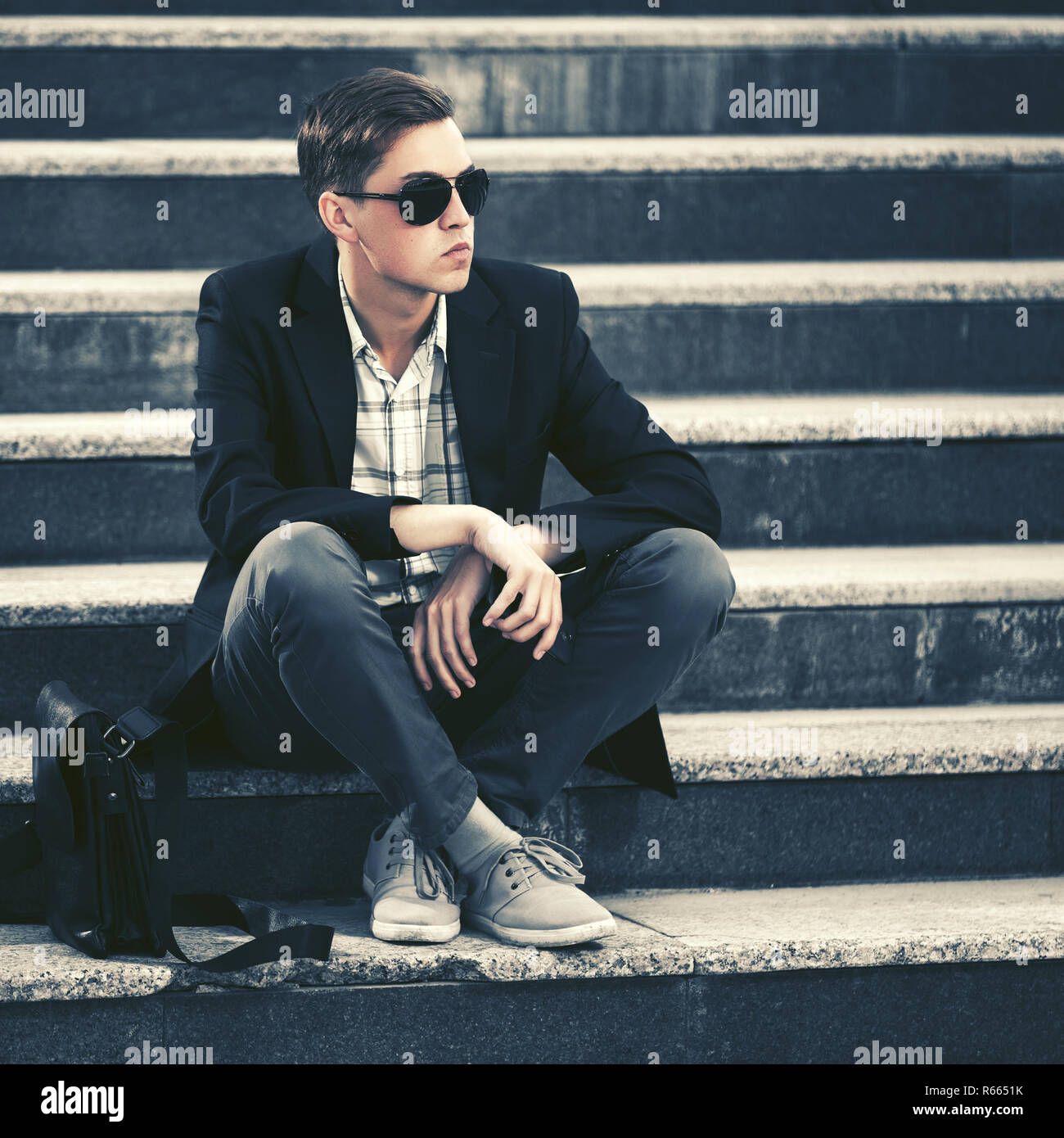 Man sitting on steps thinking hi-res stock photography and images - Alamy