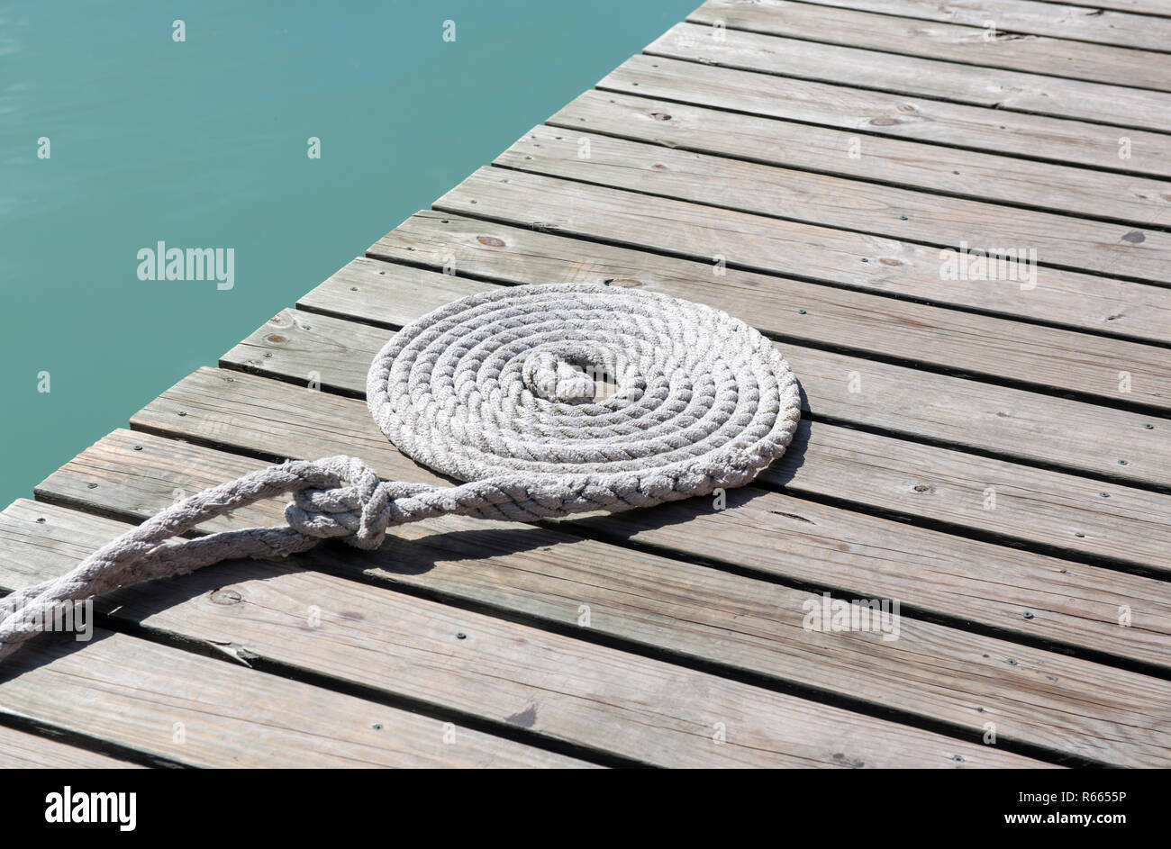 Coiled rope on pontoon St. John's Antigua Stock Photo - Alamy