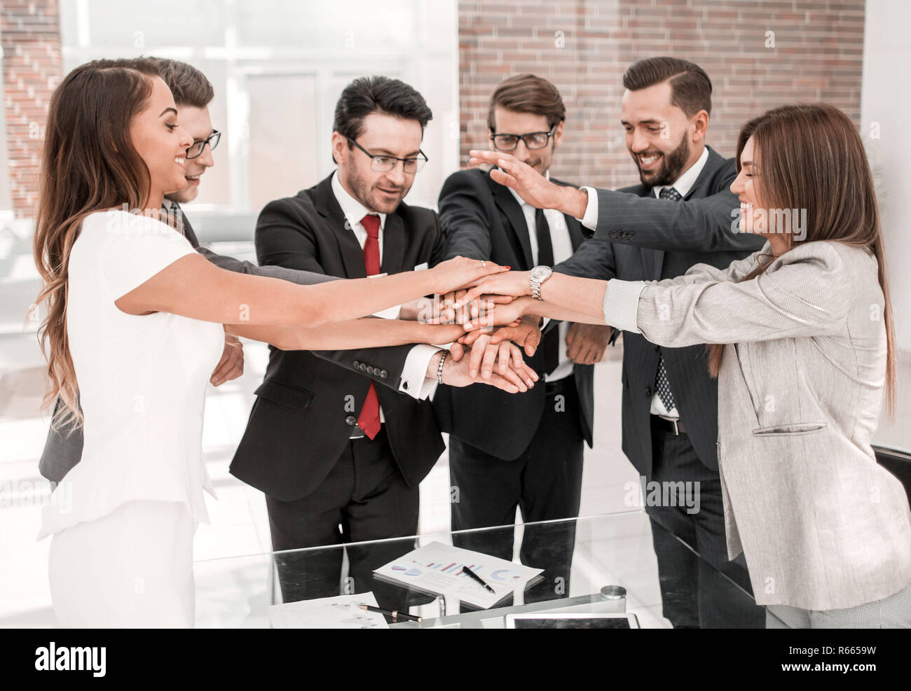 professional business team making tower out of their hands Stock Photo ...