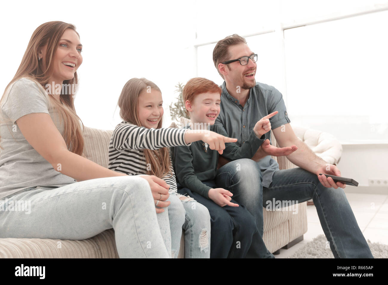 happy family watching their favorite TV show Stock Photo - Alamy