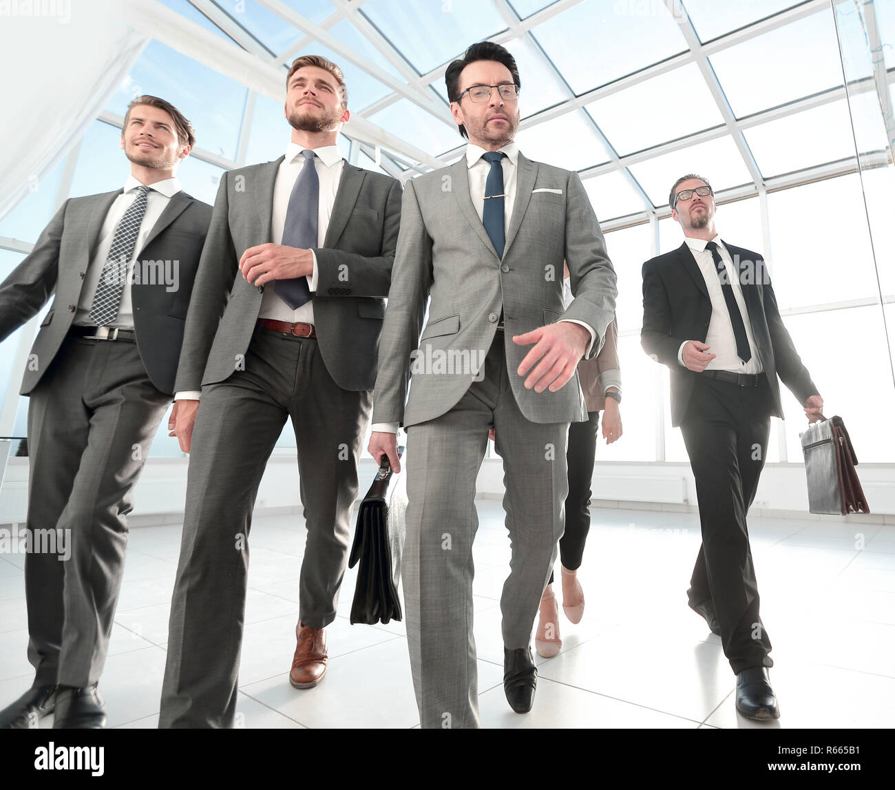business team, walking at modern office interior Stock Photo - Alamy