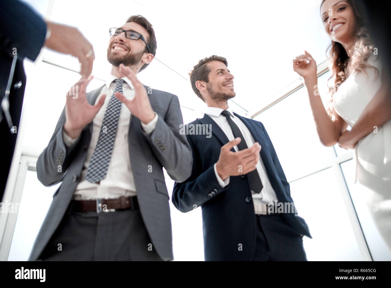Bottom view colleagues standing hi-res stock photography and images - Alamy