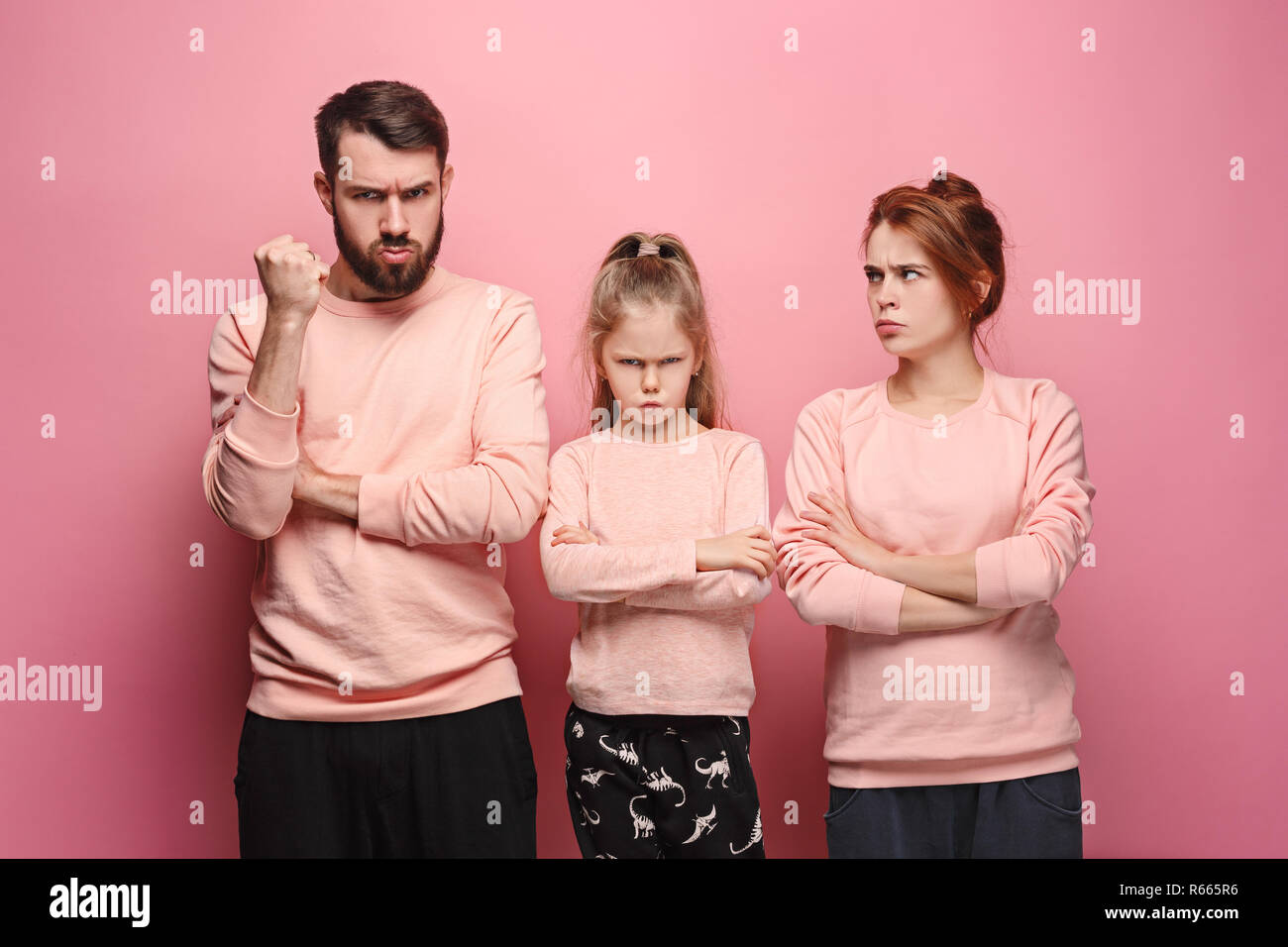The sad family on pink Stock Photo - Alamy