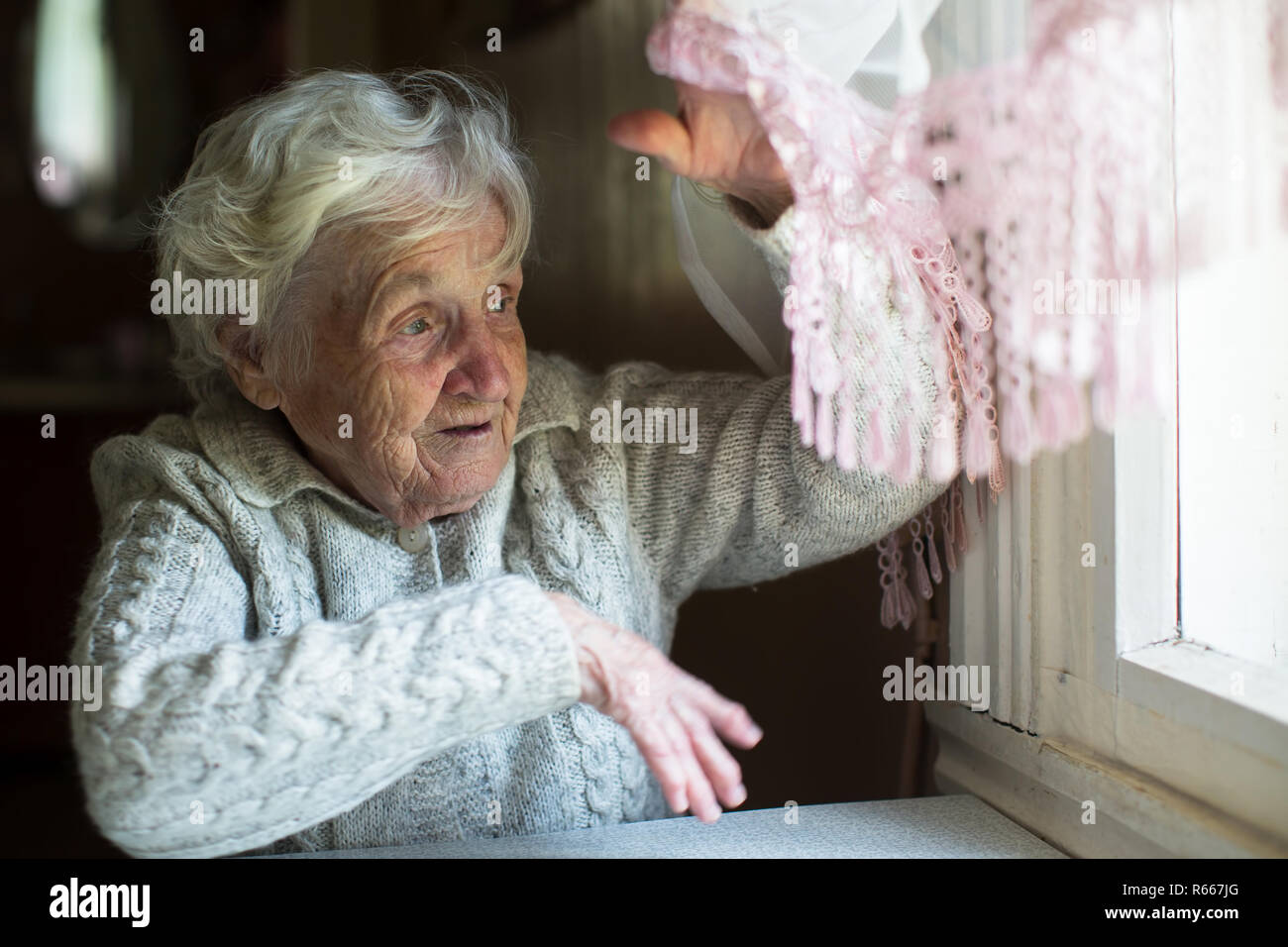 Grandma looking out window hi-res stock photography and images - Alamy