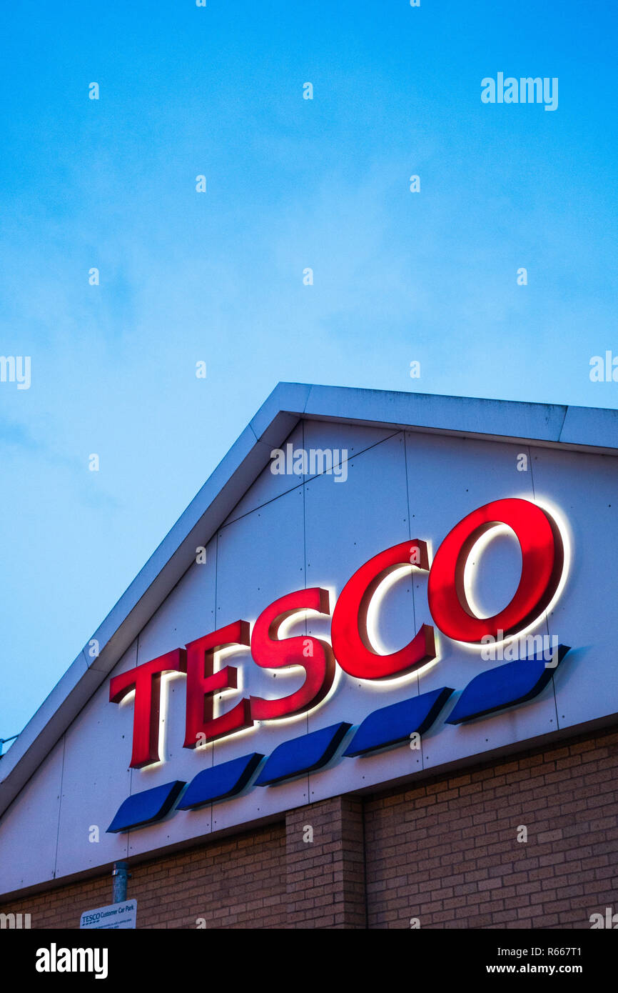 illuminated Tesco Sign at dusk in Dinnington, Rotherham UK Stock Photo ...